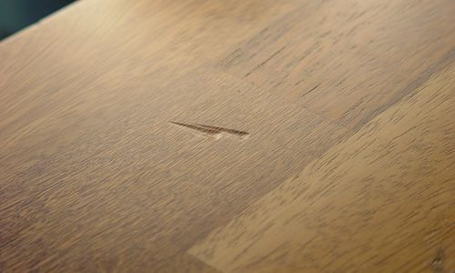 Small Dent on a Real Wood Surface